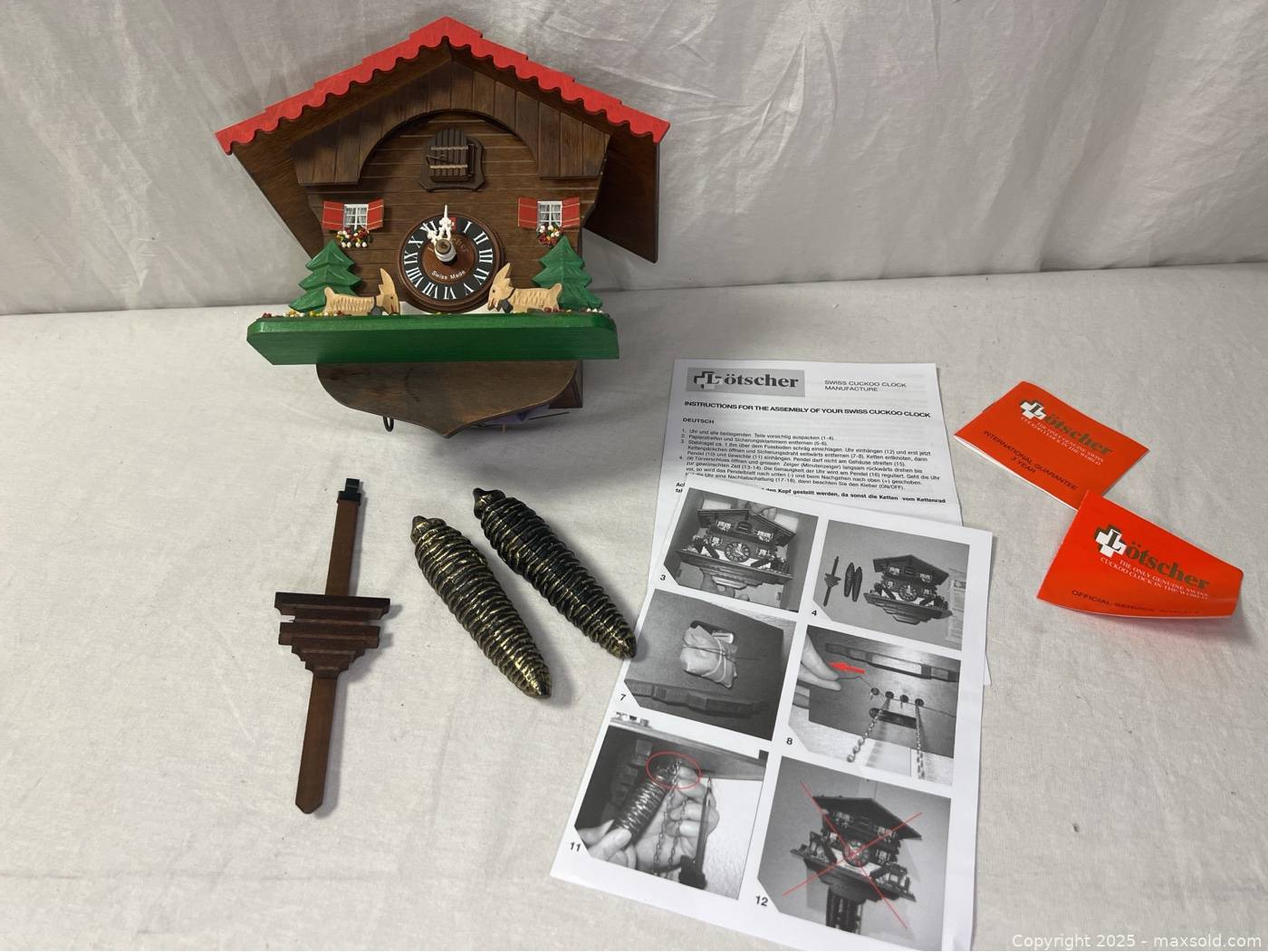 Lötscher Swiss chalet cuckoo clock with manual | Maxsold