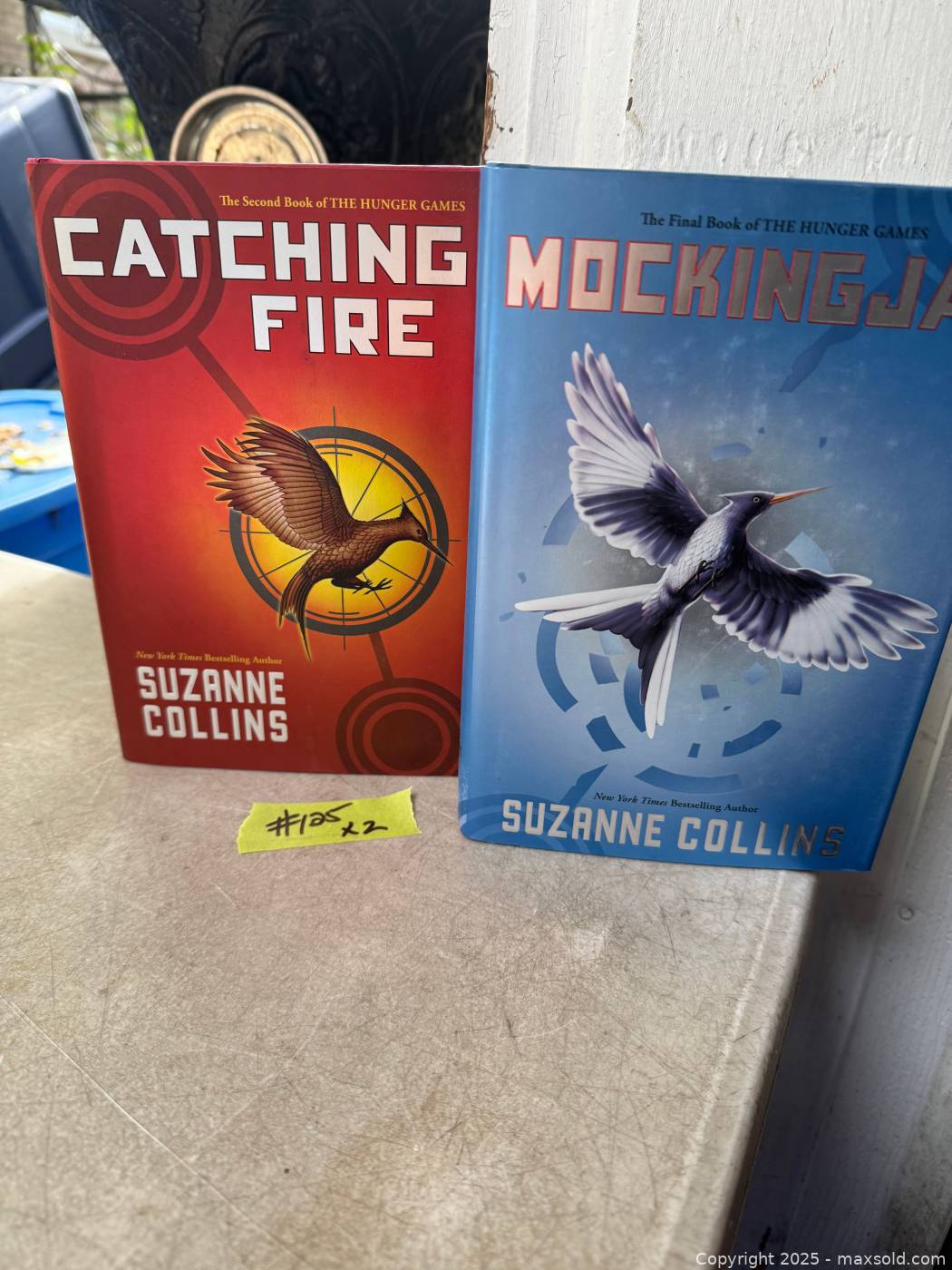 2 Suzanne Collins Hunger Games books | Maxsold