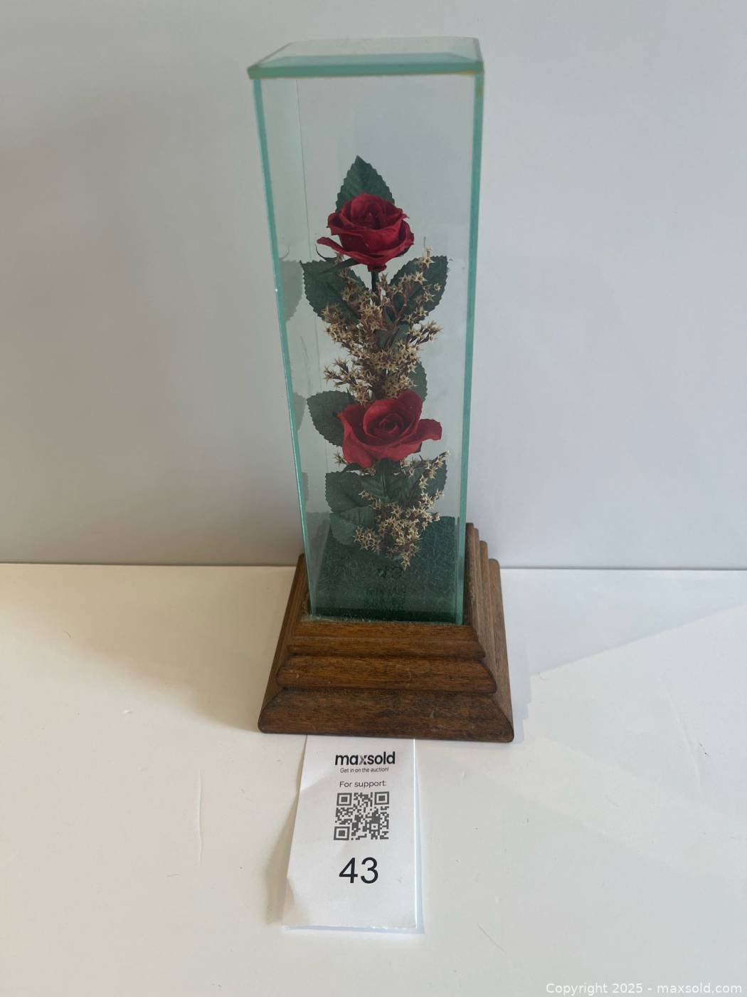 Glass-encased rose music box on wood base | Maxsold
