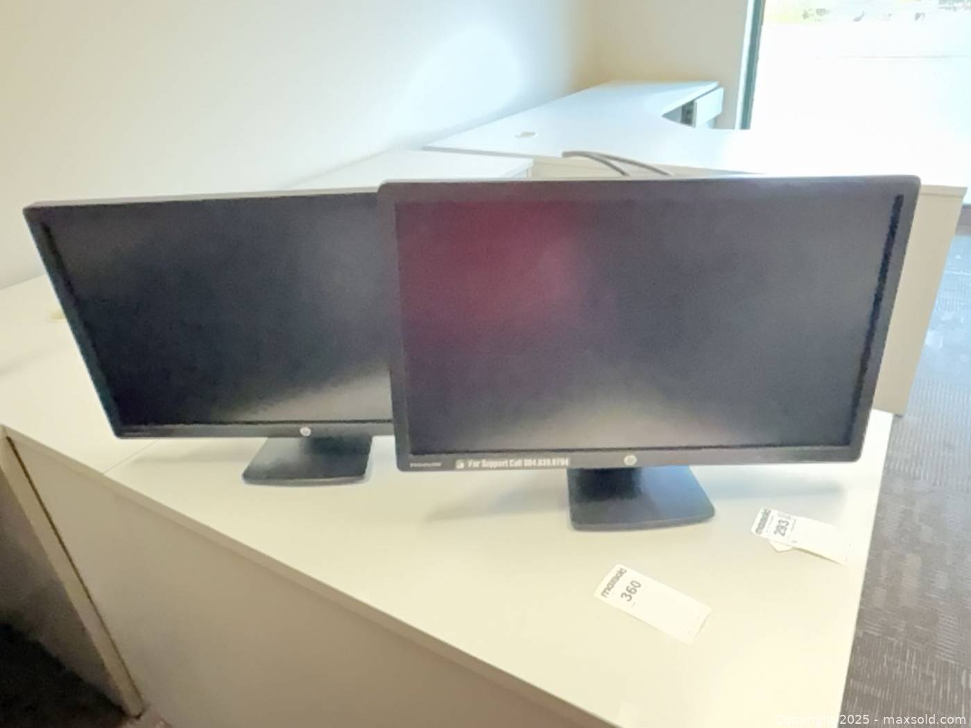 Two HP 23" LED/LCD computer monitors | Maxsold