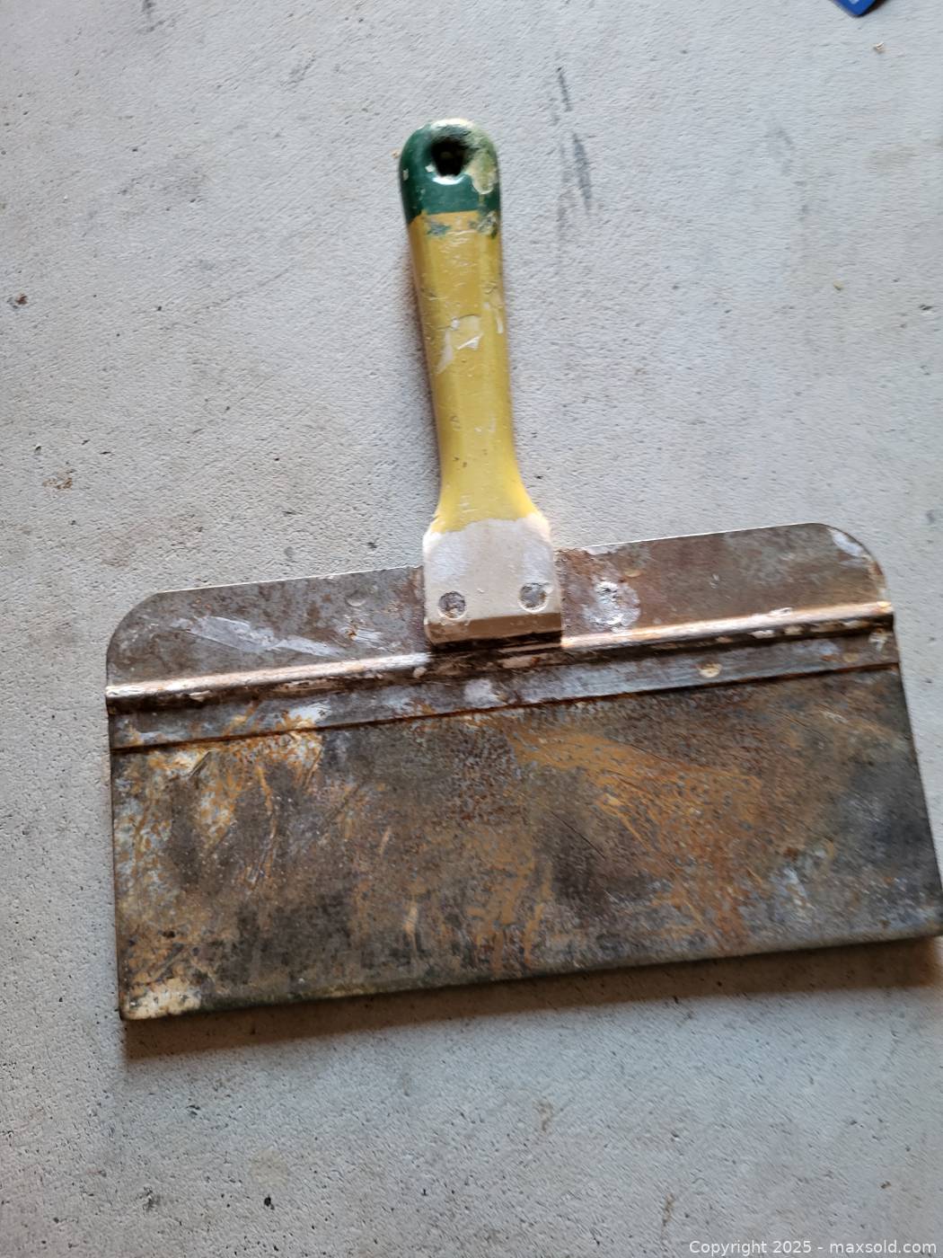 Wide metal drywall scraper | Maxsold