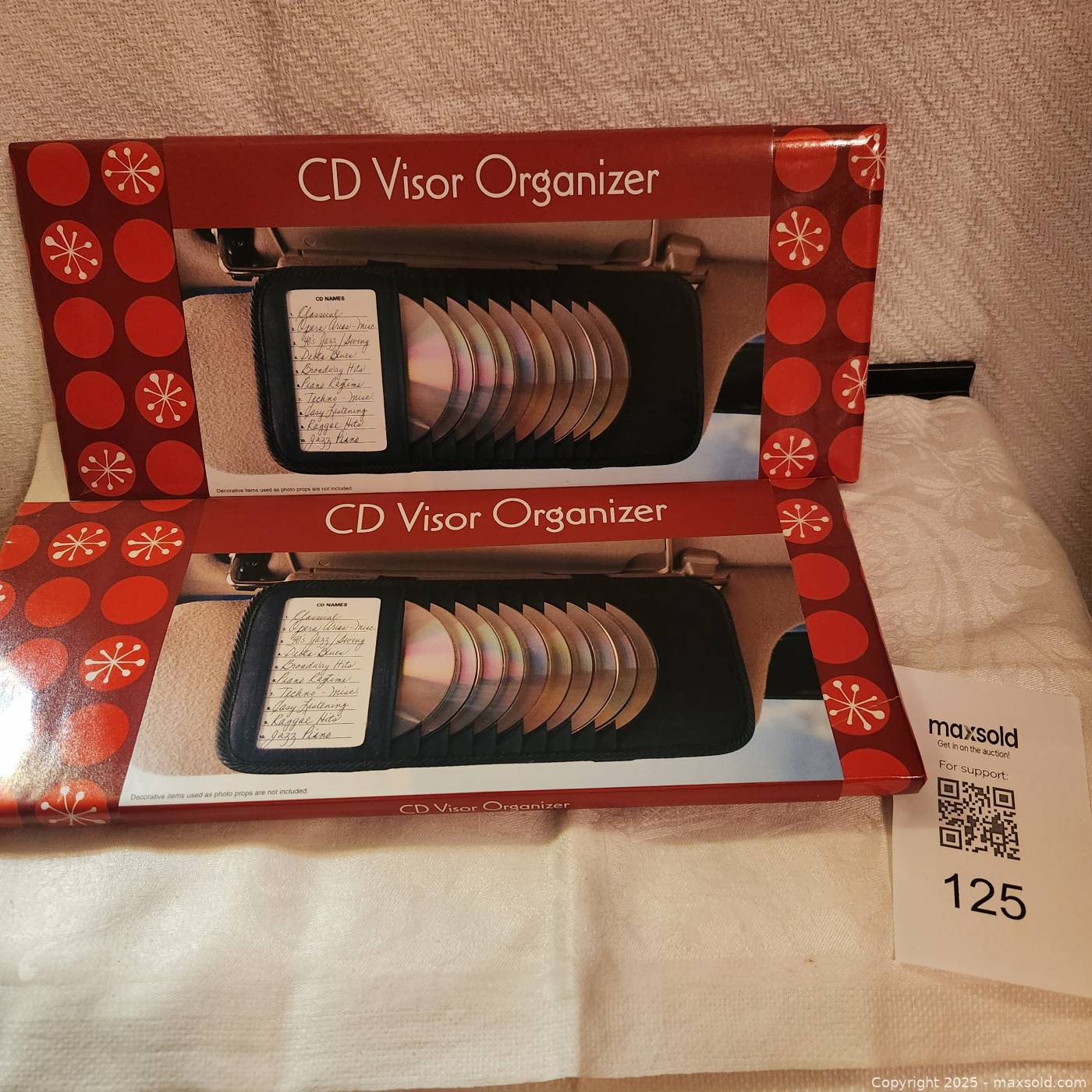 Two boxed CD visor organizers | Maxsold