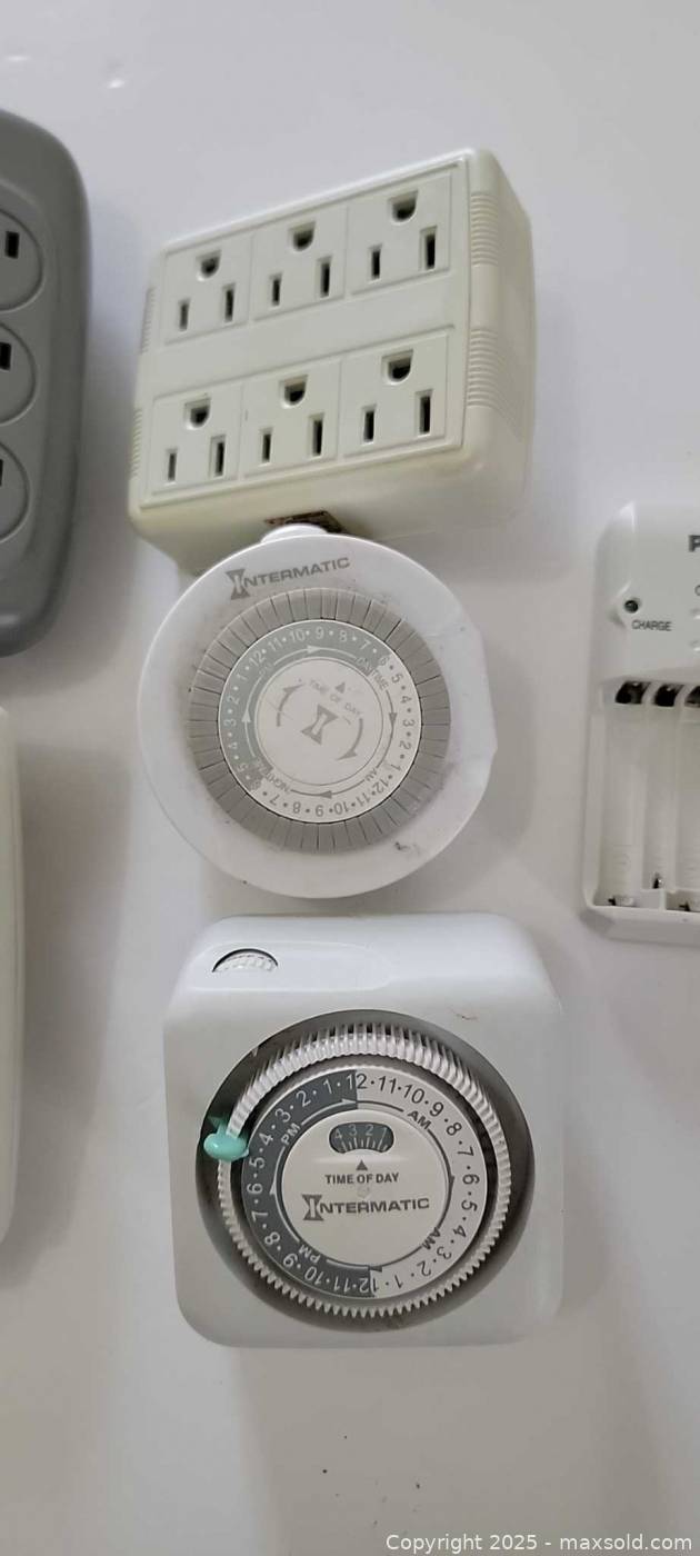 Outlet adapters, Intermatic timers, Panasonic charger | Maxsold