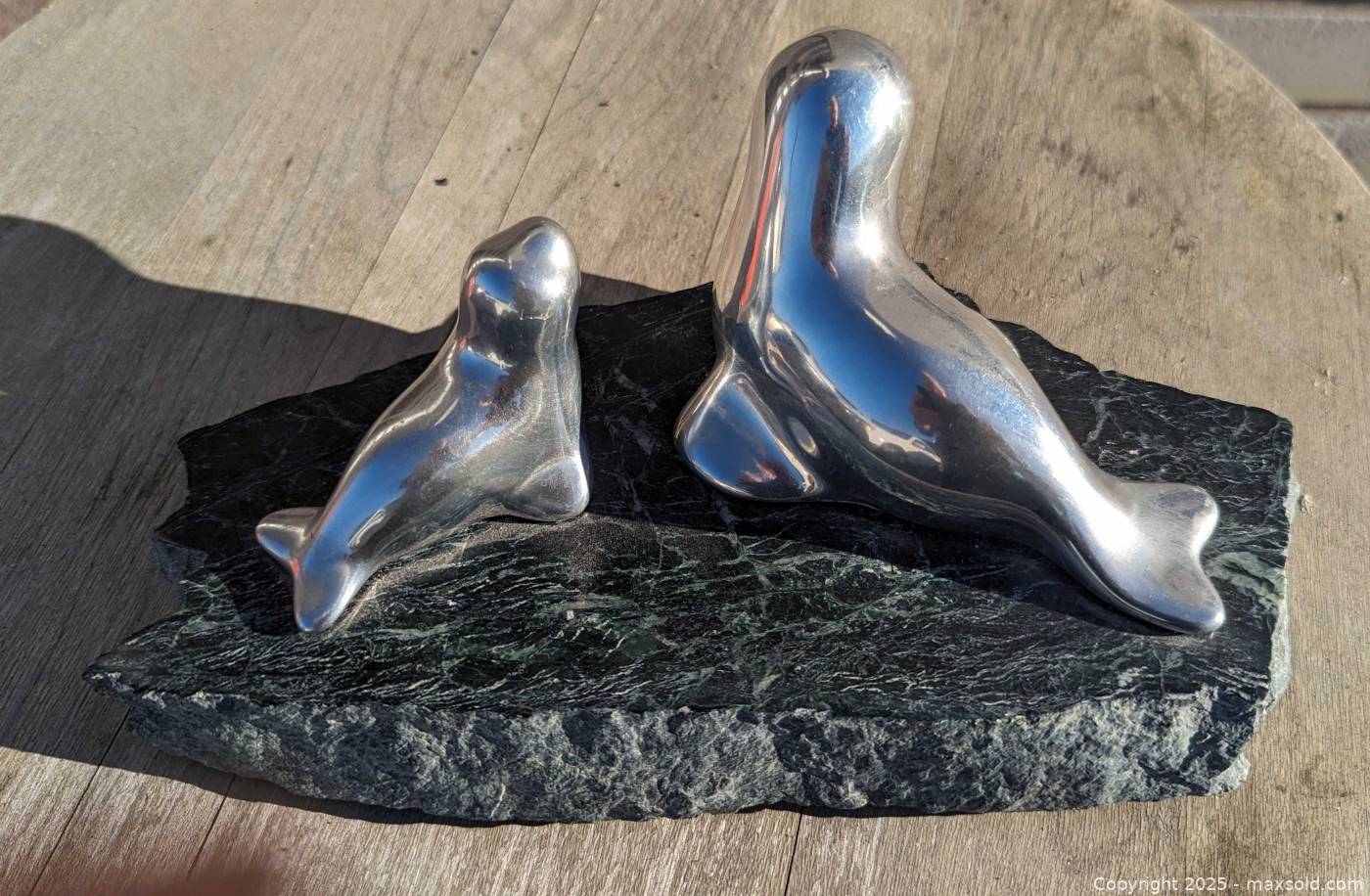 Hoselton polished-aluminum mother and pup seal sculptures on slate base ...