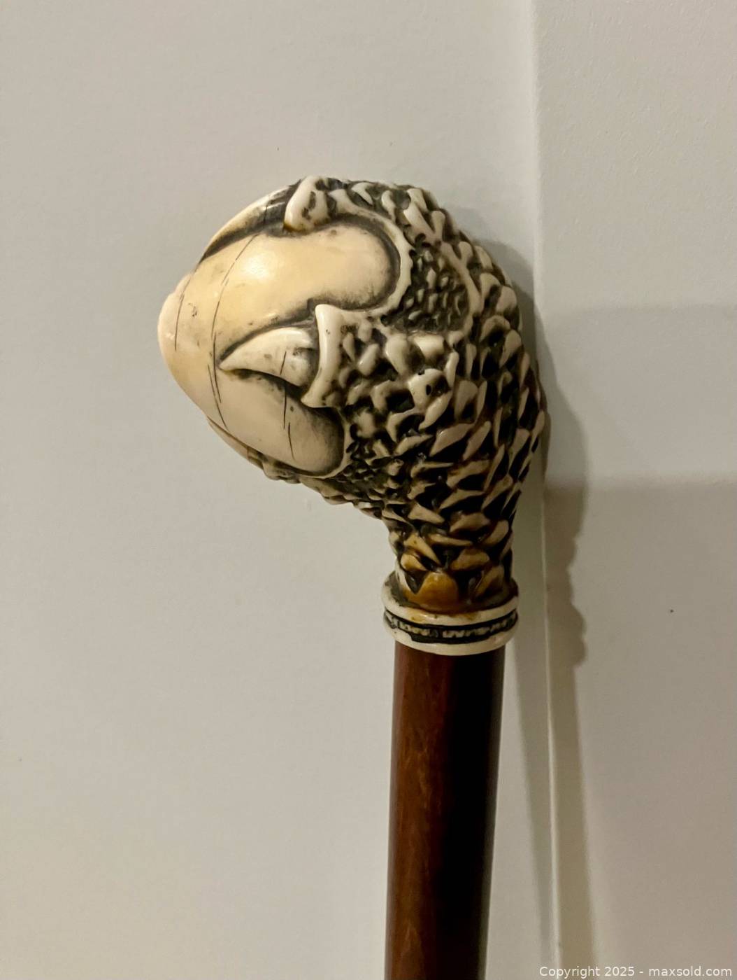 Hardwood cane with synthetic eagle claw handle | Maxsold