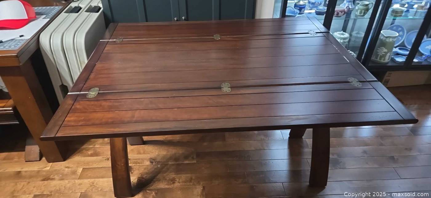 Solid wood hinged-top folding dining table | Maxsold