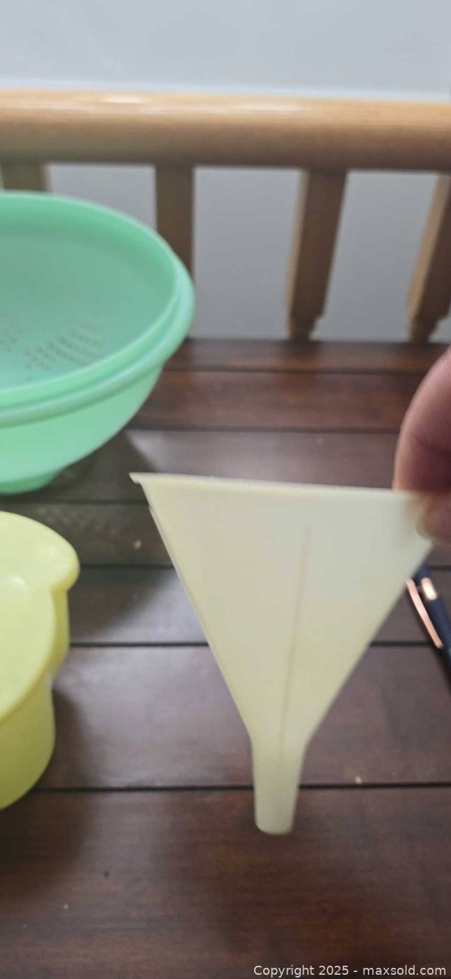 Tupperware yellow 1-quart milk pitchers, green colander, off-white ...