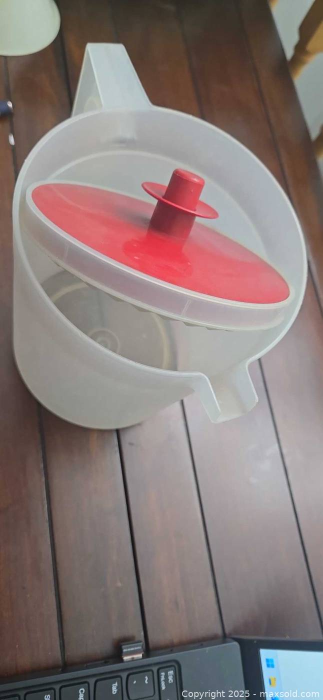 Tupperware plastic pitcher with red push-button lid | Maxsold