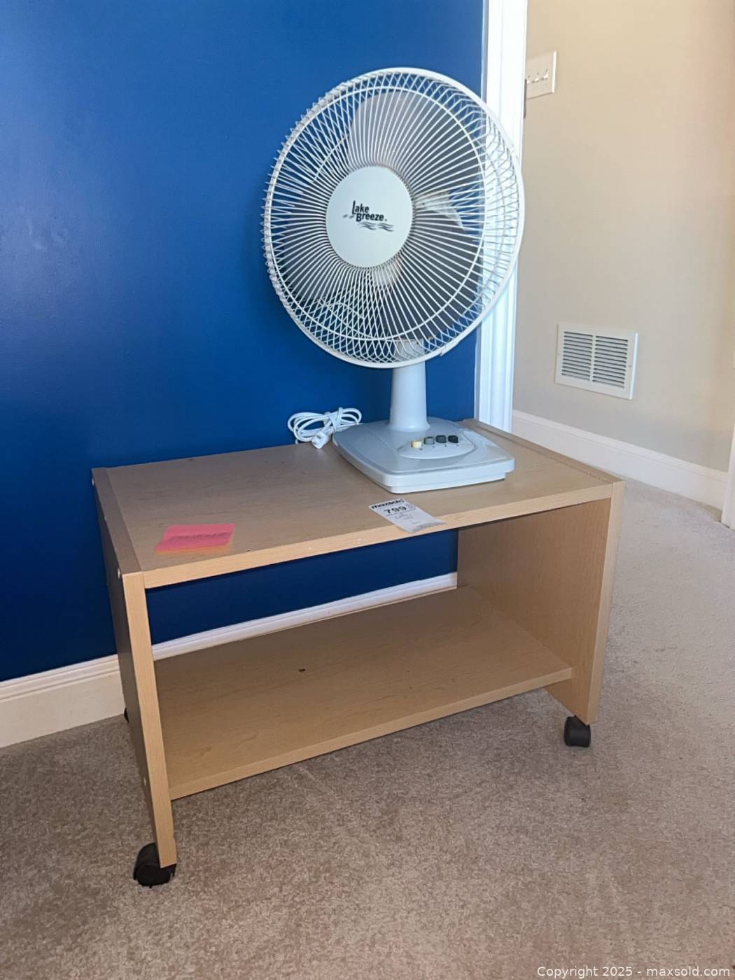 Rolling utility table on casters and Lake Breeze corded table fan | Maxsold