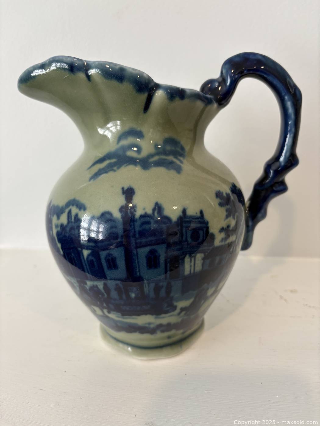 Flow blue plate, reference book, ceramic pitcher | Maxsold