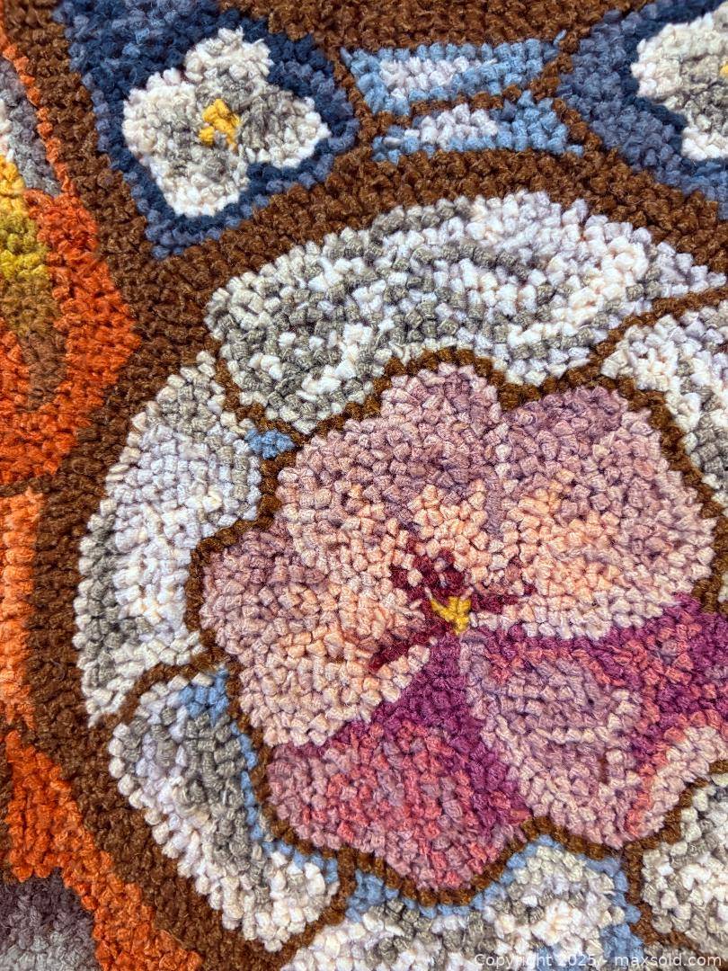 Vintage hand-hooked floral textile art in teak frame | Maxsold