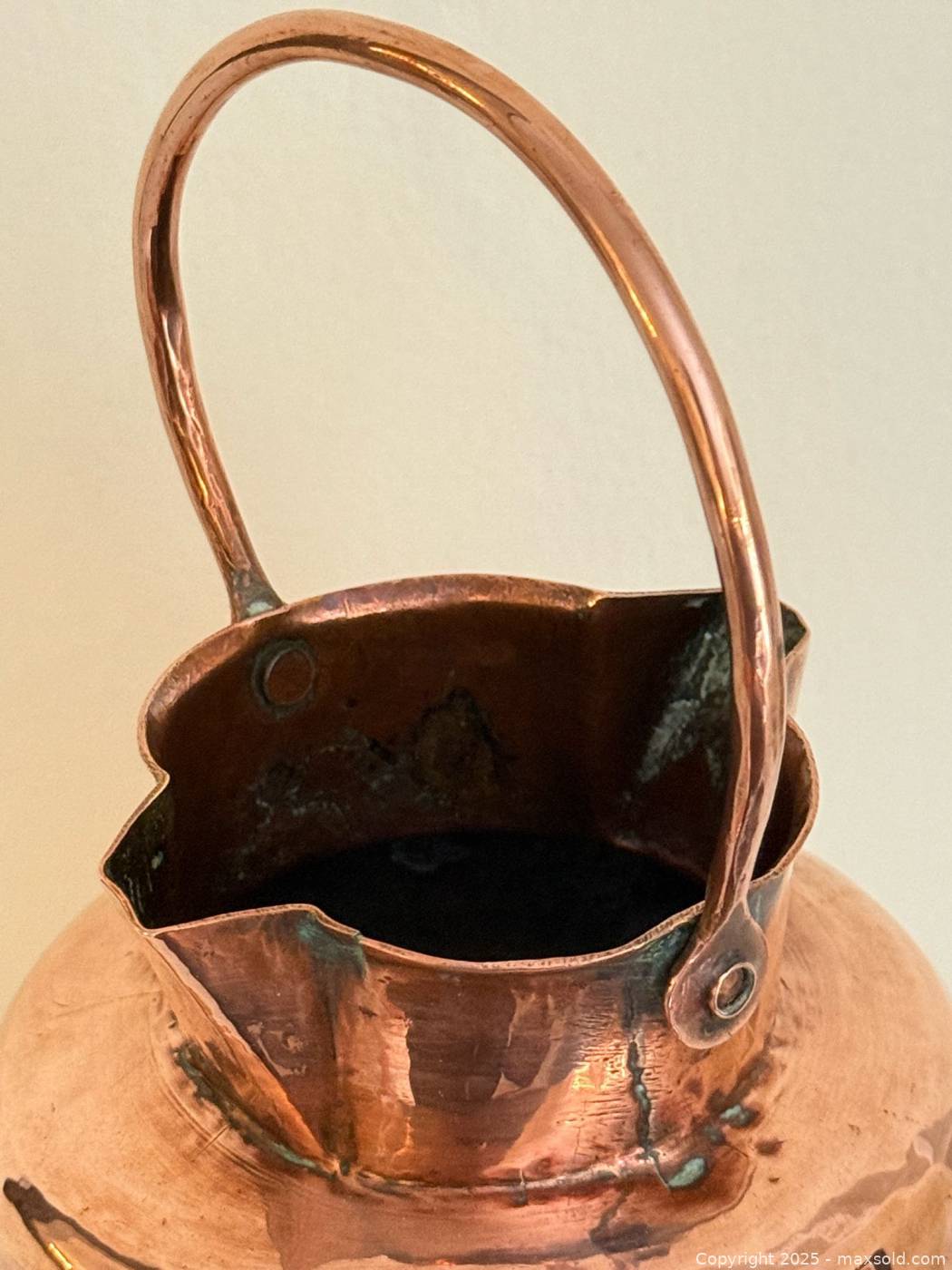 Antique hammered copper double-spout pitcher | Maxsold
