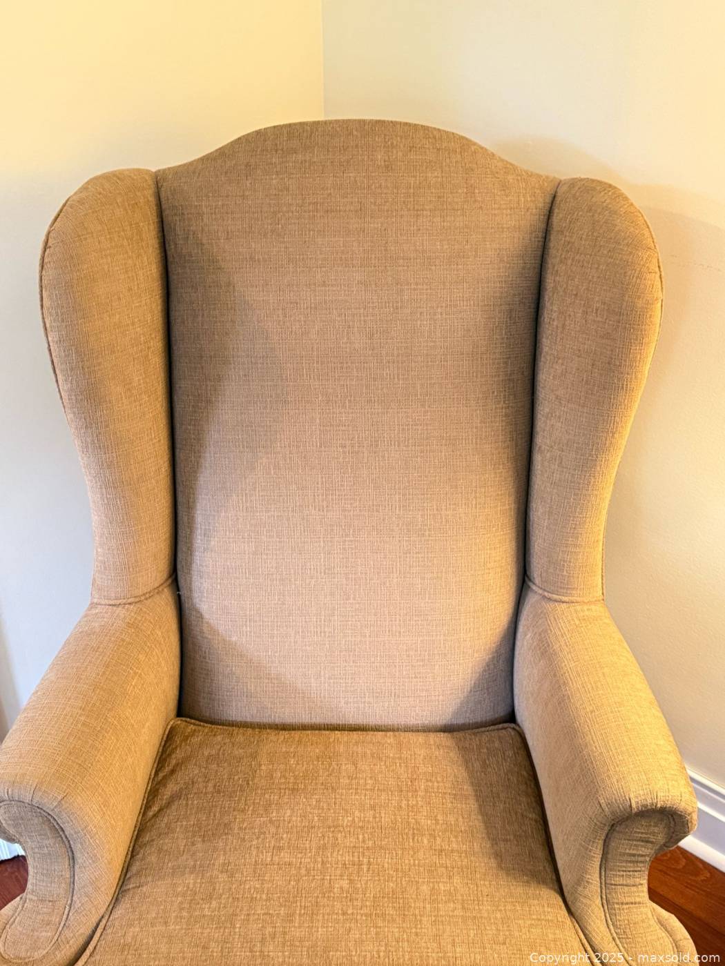 Antique wingback armchair | Maxsold