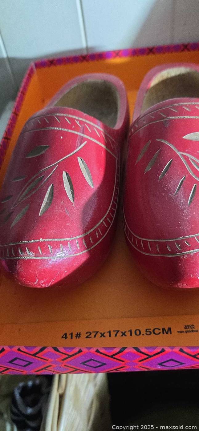 Carved red wooden clogs and framed art print | Maxsold