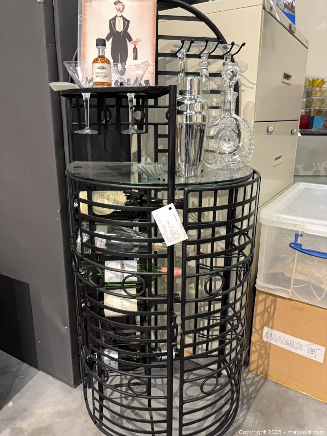 Freestanding half-round metal wine rack bar cabinet with contents | Maxsold