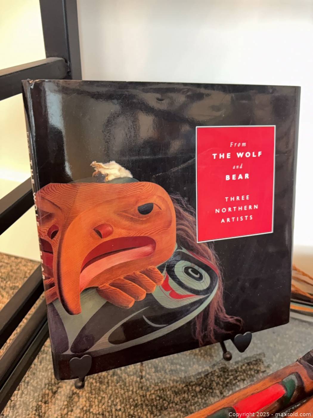 Carved 24" wooden canoe & Indigenous art book | Maxsold