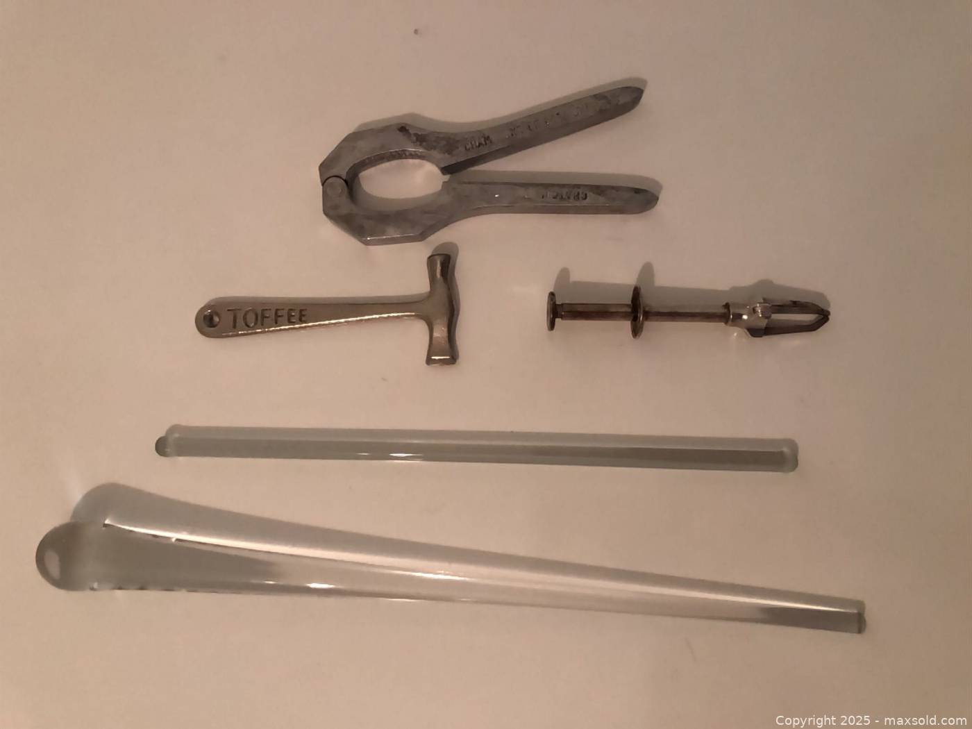 Assorted glass stir rods and metal tools | Maxsold