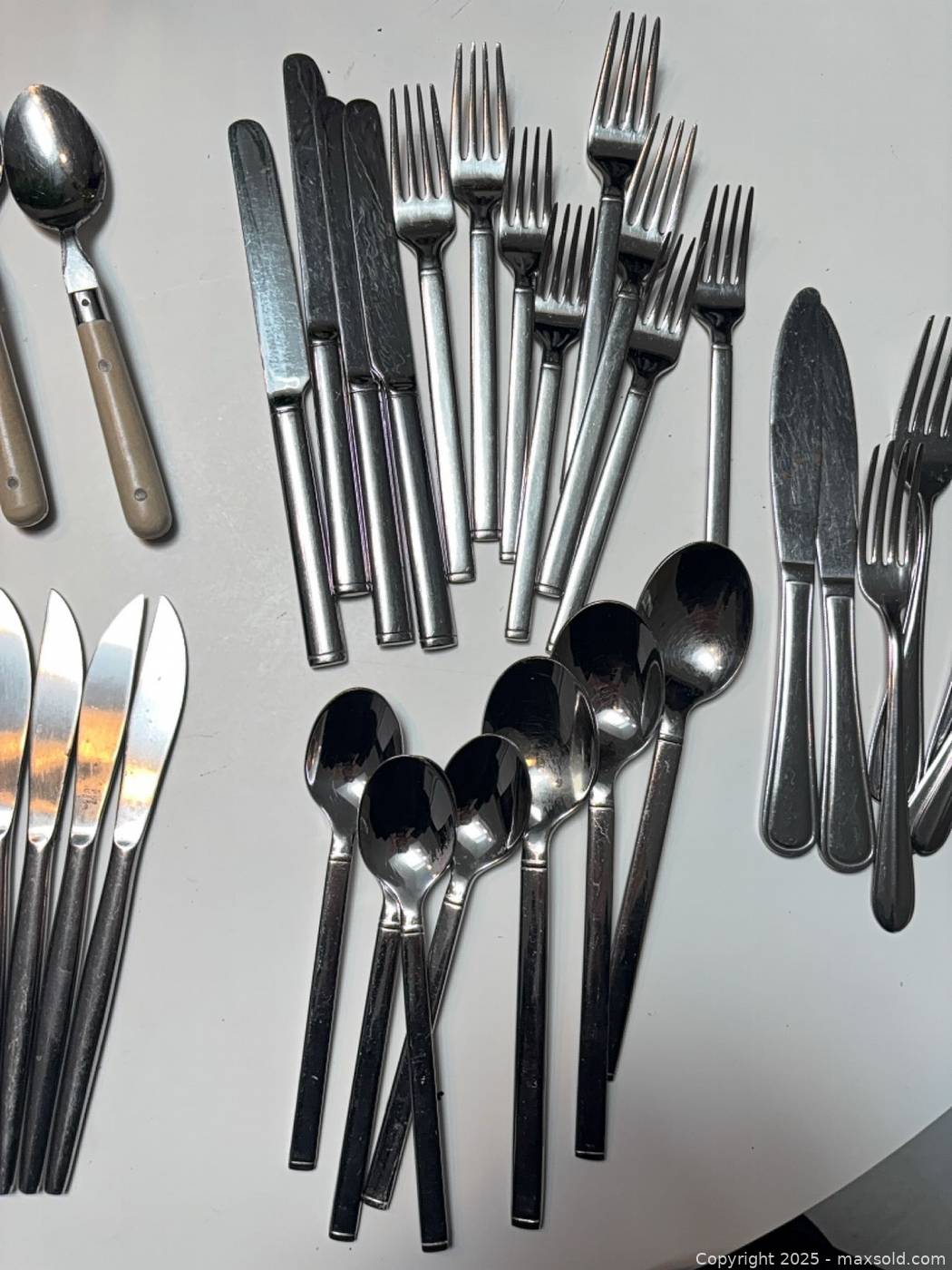 Assorted stainless-steel cutlery, ~70 pcs | Maxsold