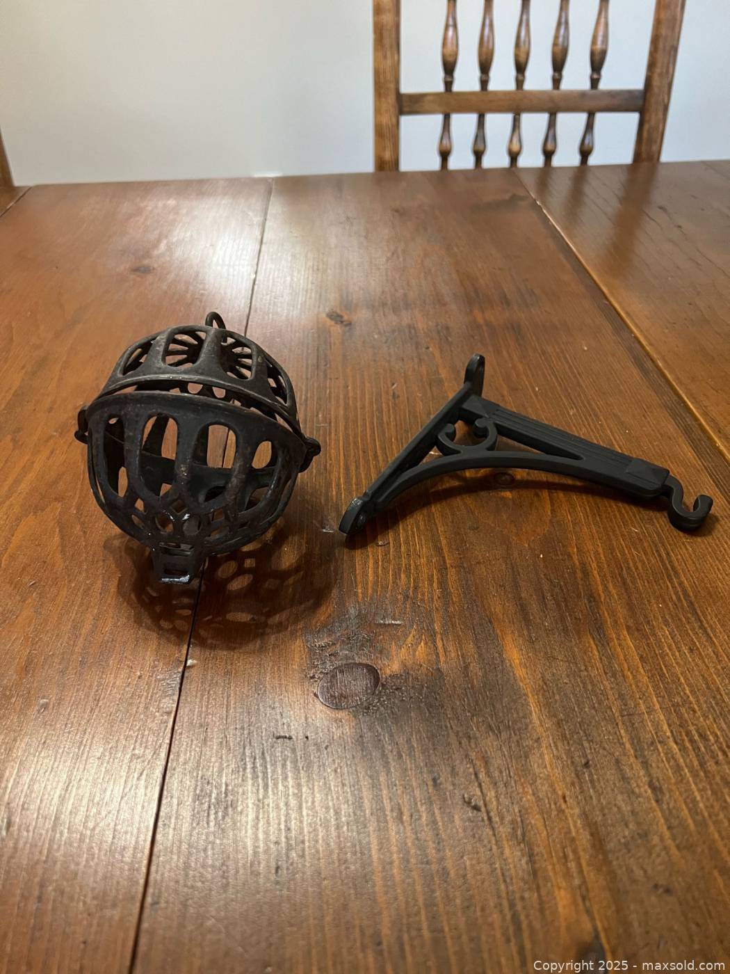 Antique cast iron string holder with bracket | Maxsold