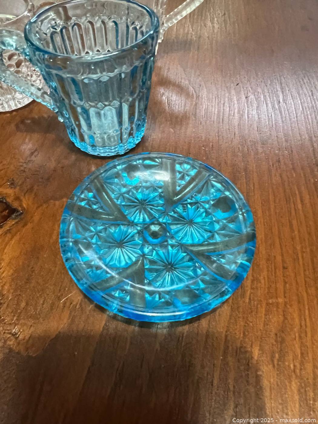 Miniature clear and blue pressed glass cups | Maxsold