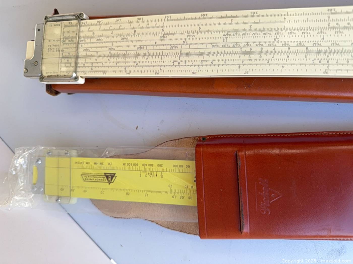 Two Rickett antique slide rules | Maxsold