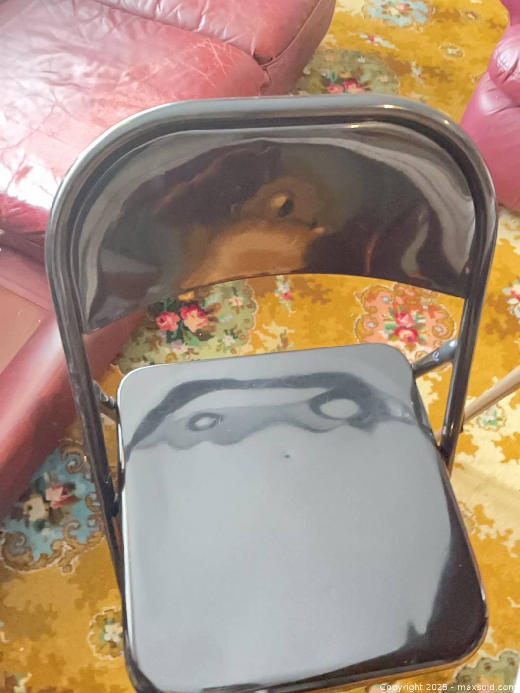 Padded square folding card table and two metal folding chairs with ...