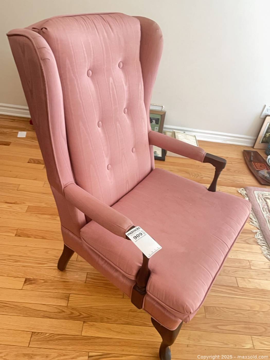 Pink upholstered wingback armchair | Maxsold