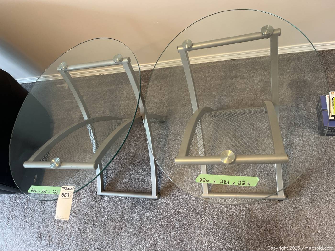 Pair of round glass side tables | Maxsold
