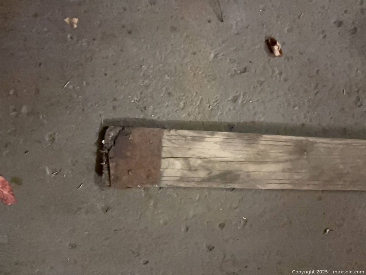 Wooden ski with rusted metal ferrule | Maxsold