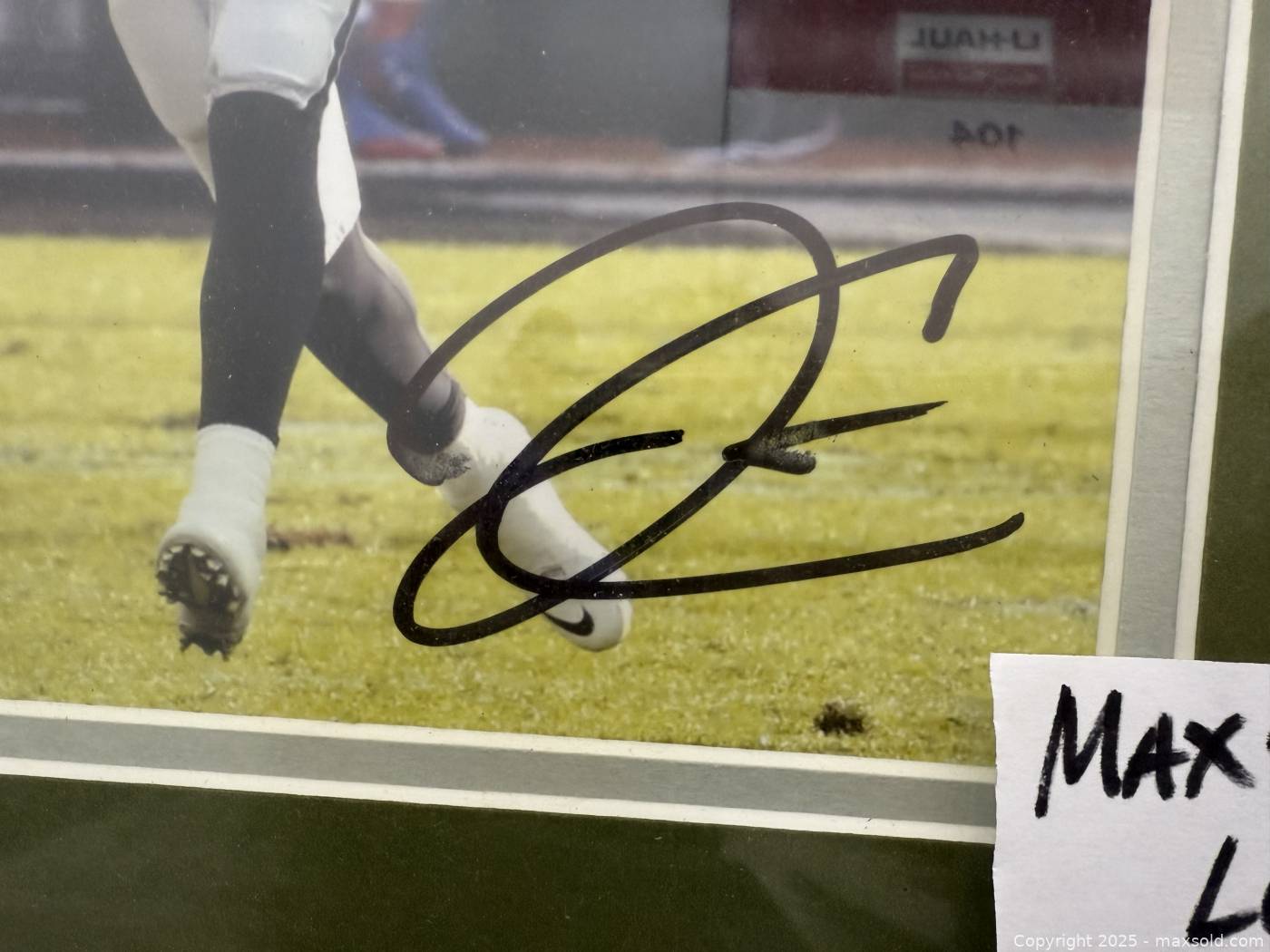 Derek Carr signed photo with Raiders programs | Maxsold