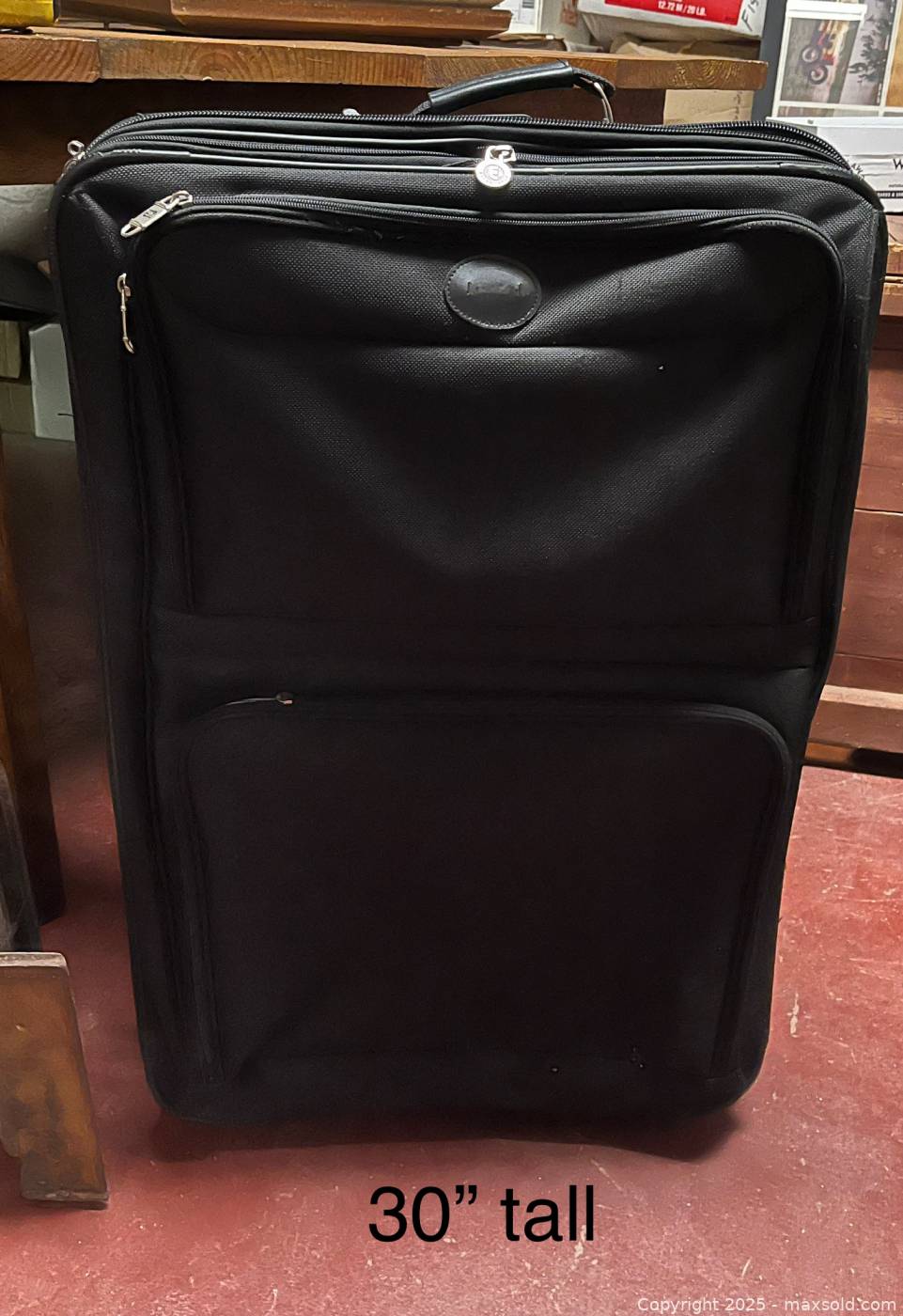 Black soft-sided suitcase 30 in | Maxsold