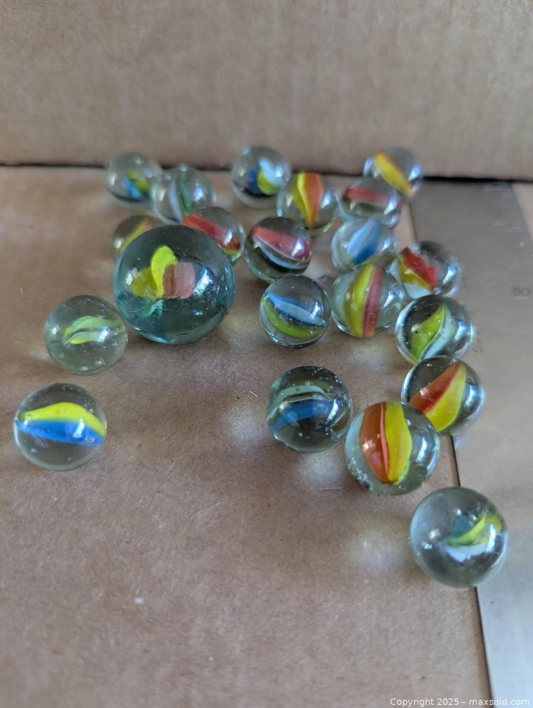 Twenty-One Vintage Cat’s Eye Glass Marbles | Maxsold