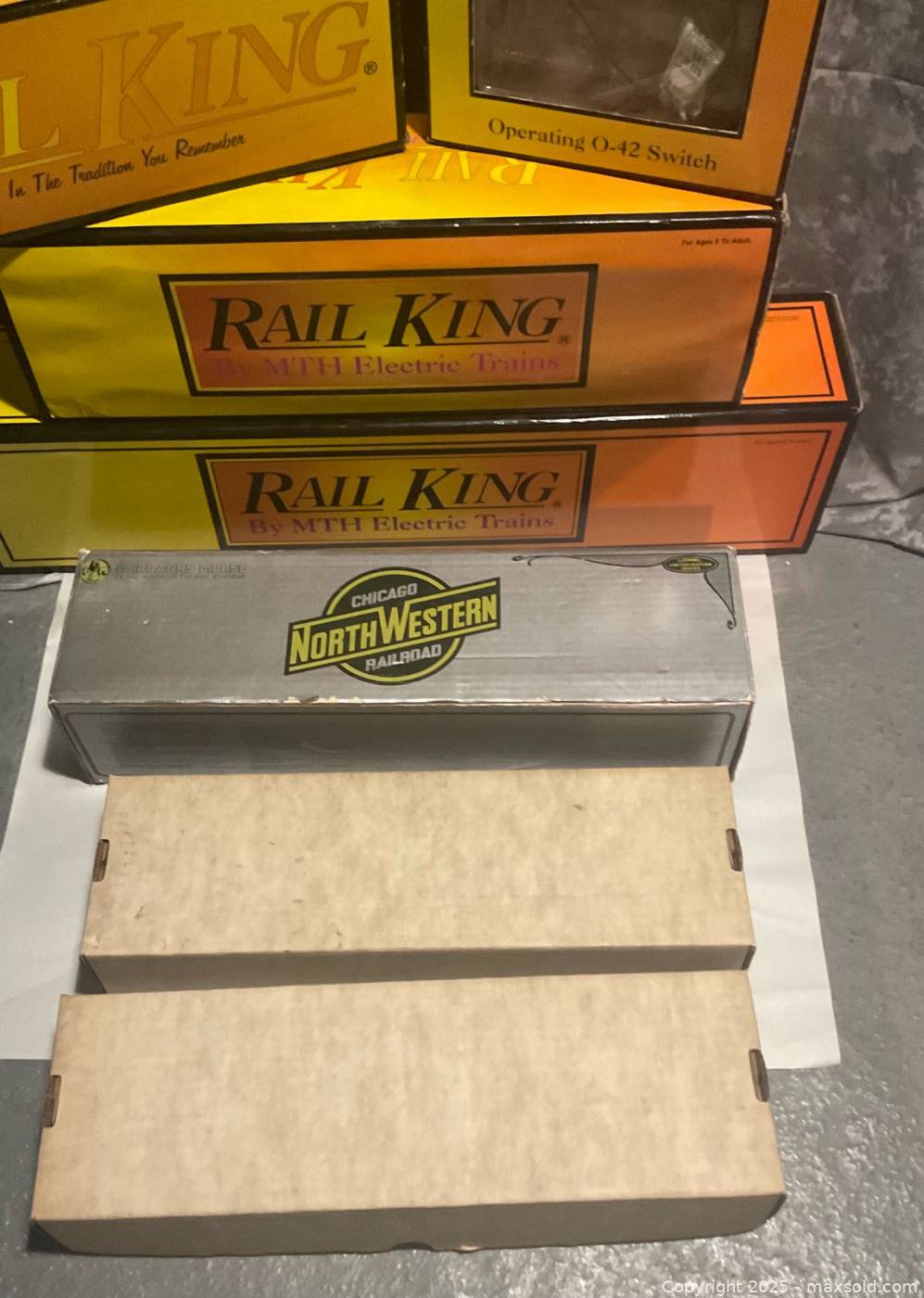 7 empty O gauge train boxes | Maxsold