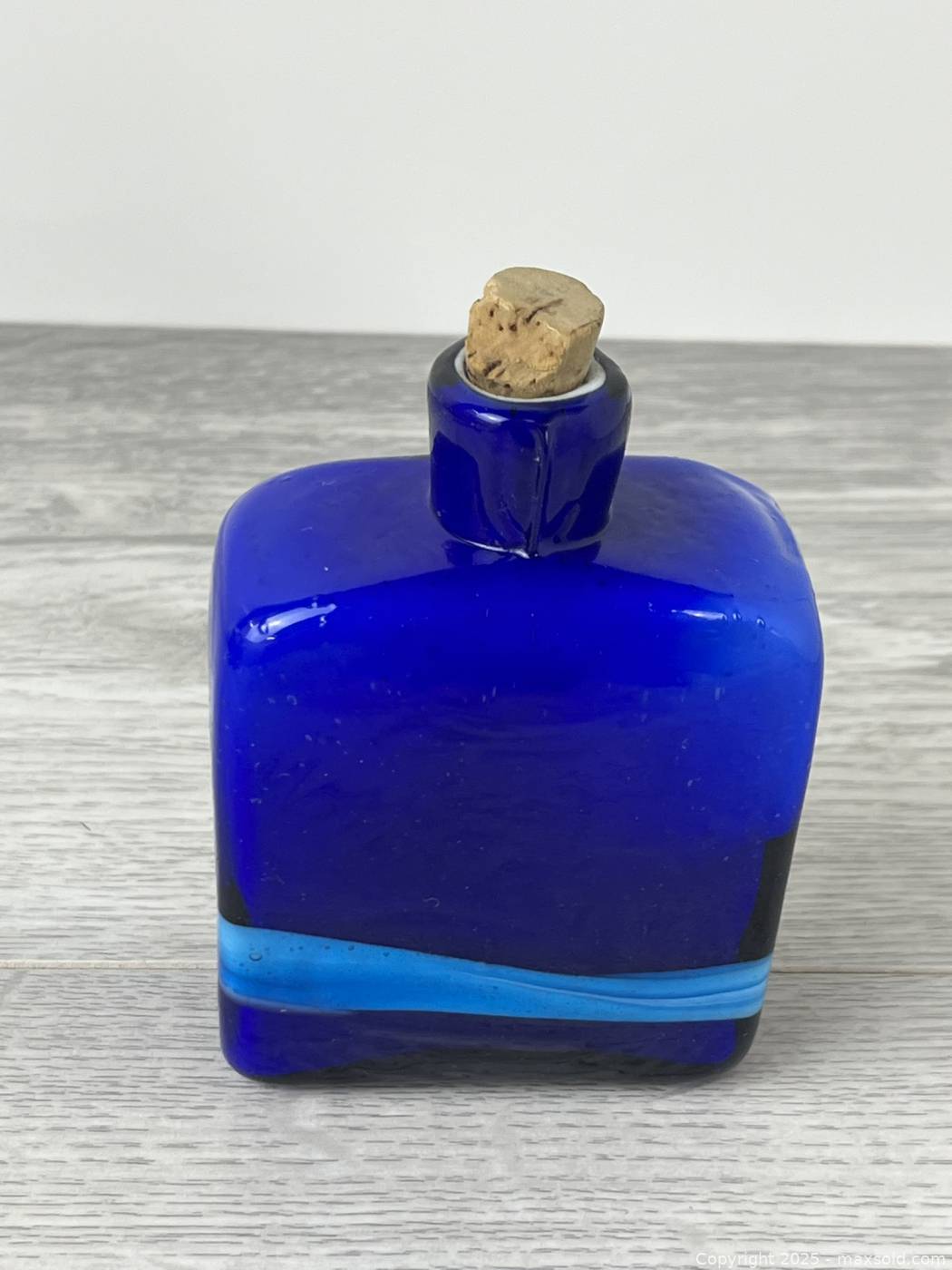 Vintage cobalt blue striped glass bottle with cork topper | Maxsold
