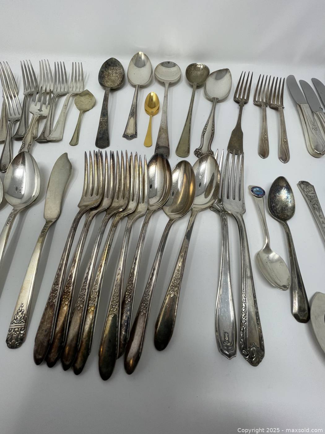 Assorted silver-plated flatware and serving pieces | Maxsold