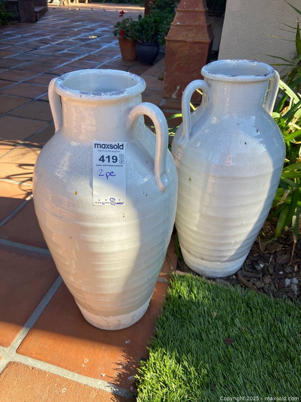 Pair of 24" off-white ceramic amphora vases | Maxsold