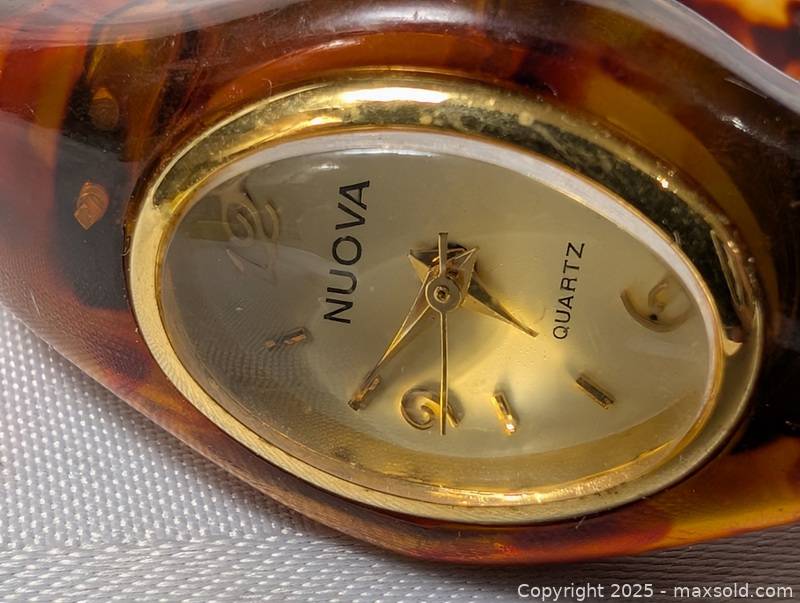 Nuova faux amber bangle quartz watch | Maxsold