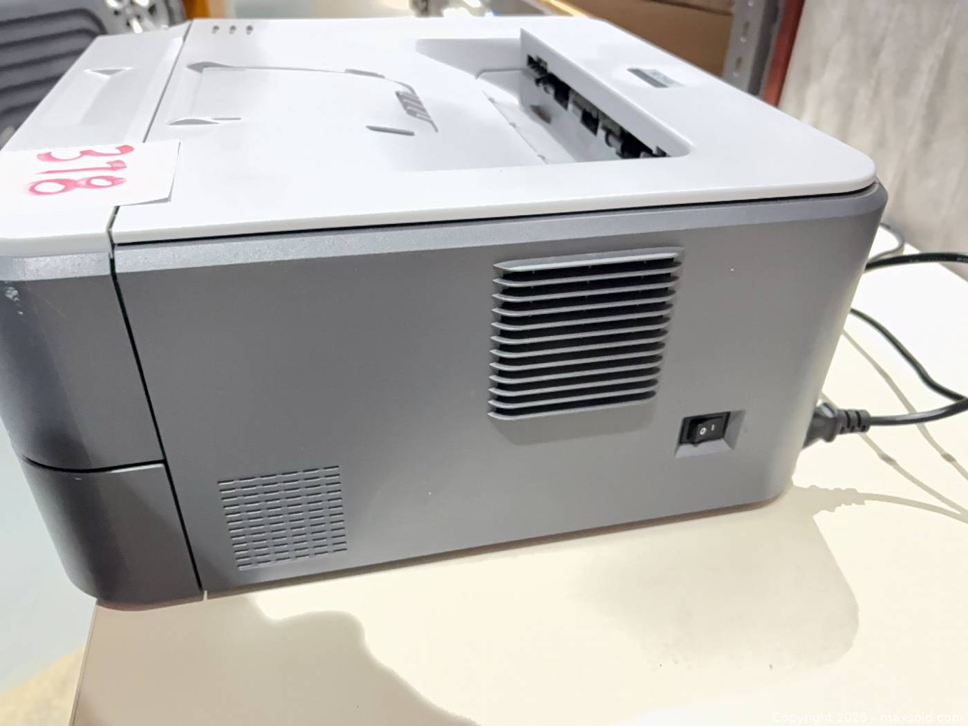 Brother HL-2140 monochrome laser printer & photo paper | Maxsold