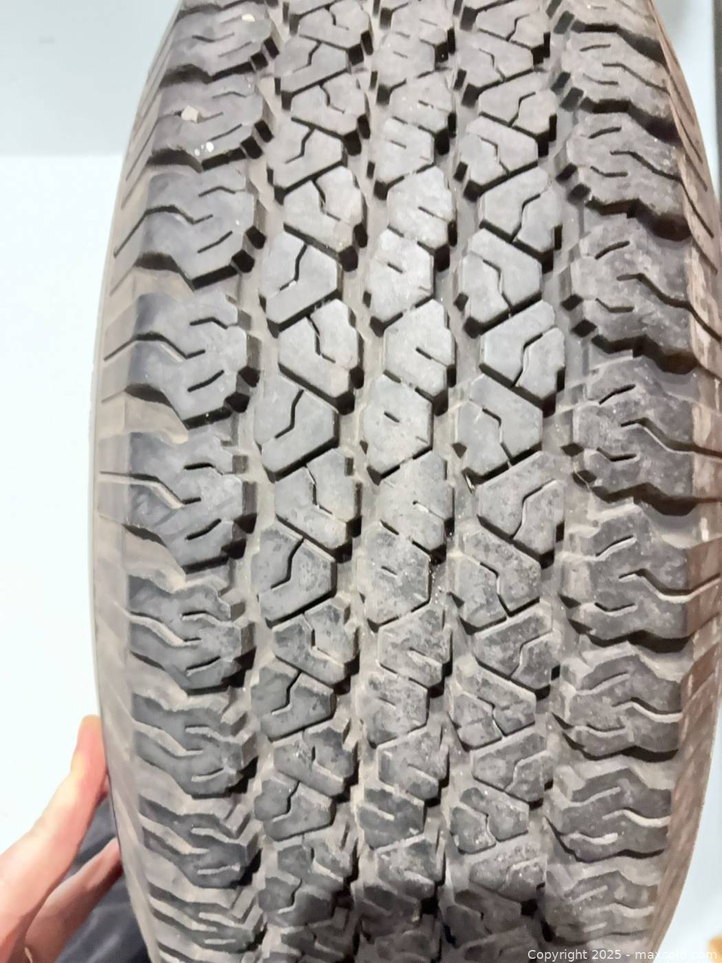 Goodyear Wrangler RT/S tire on 5-spoke alloy wheel | Maxsold