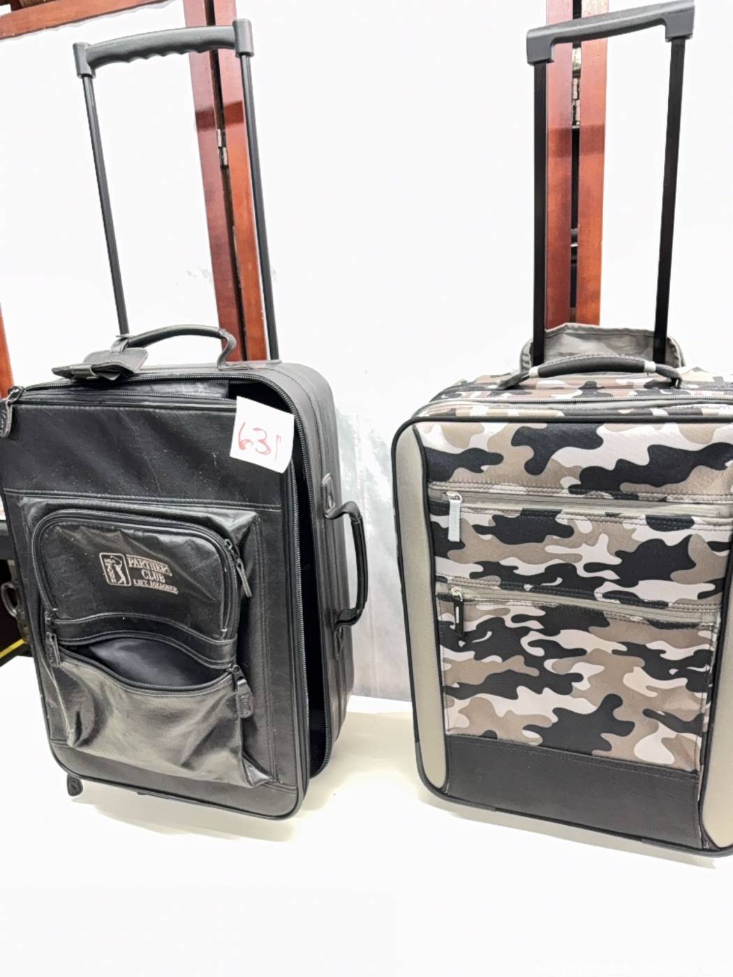 Partners Club & Camouflage Carry-On Rollers | Maxsold