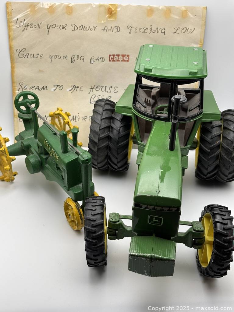 2 John Deere cast iron toy tractors | Maxsold