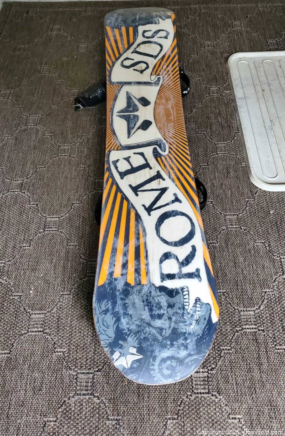 Rome 153 cm Postermania snowboard with bindings | Maxsold