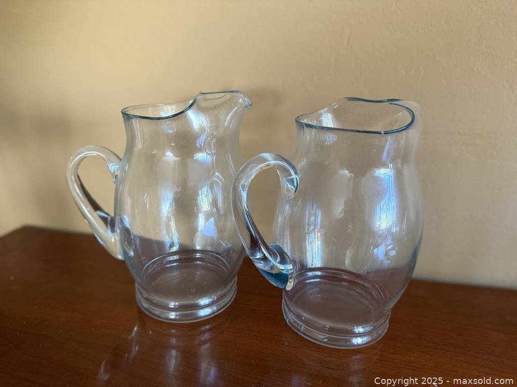 Vintage clear glass pitchers pair | Maxsold