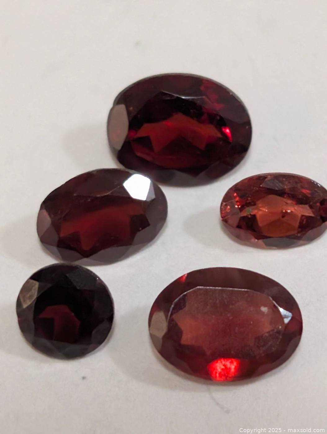 Five loose genuine garnet gemstones | Maxsold