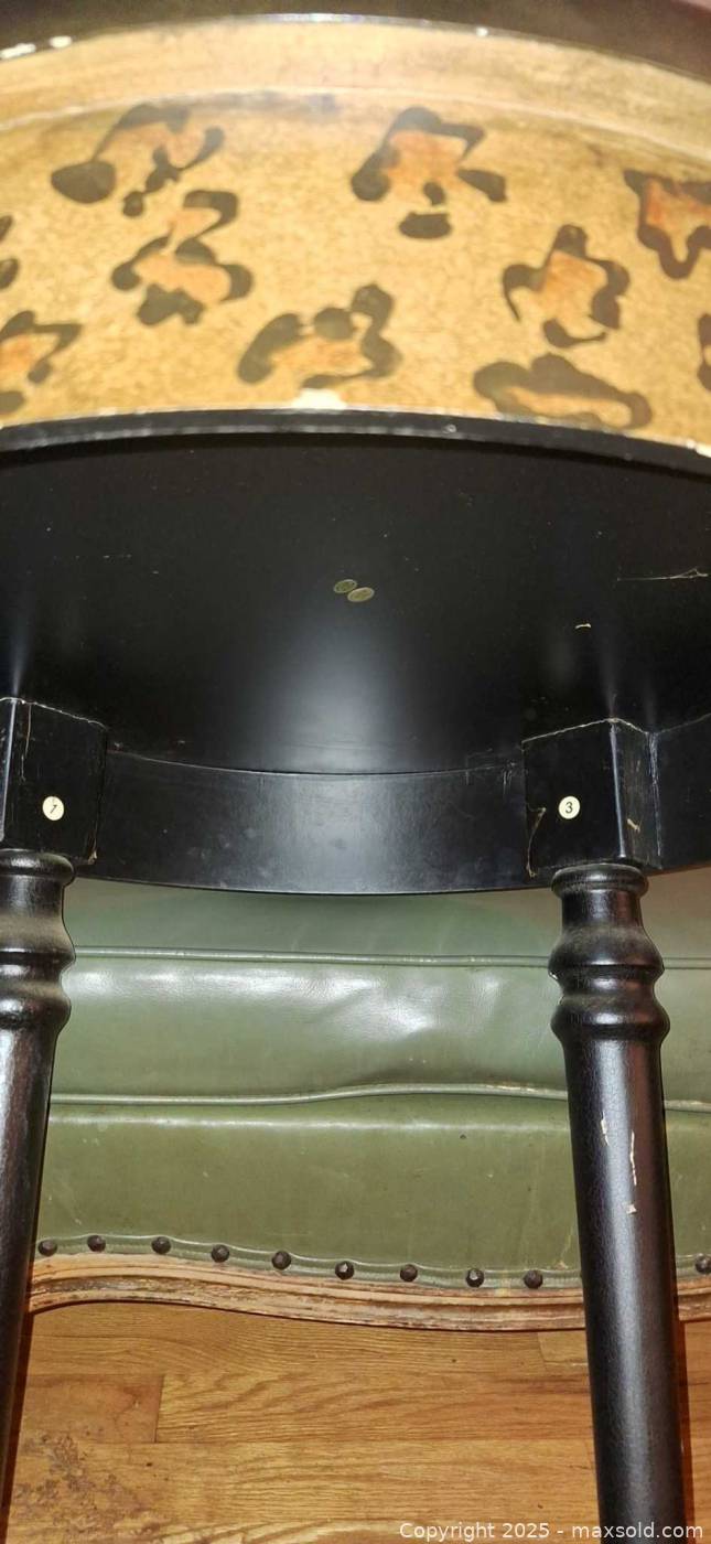 Round leopard print accent table | Maxsold