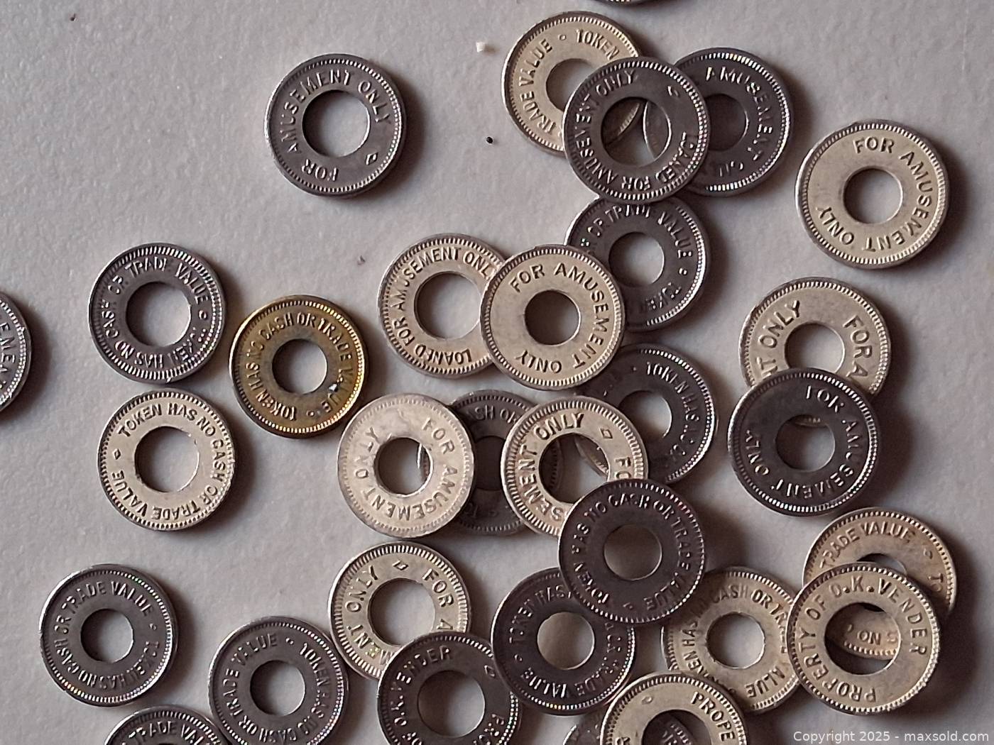 Arcade amusement tokens, approx 34 | Maxsold