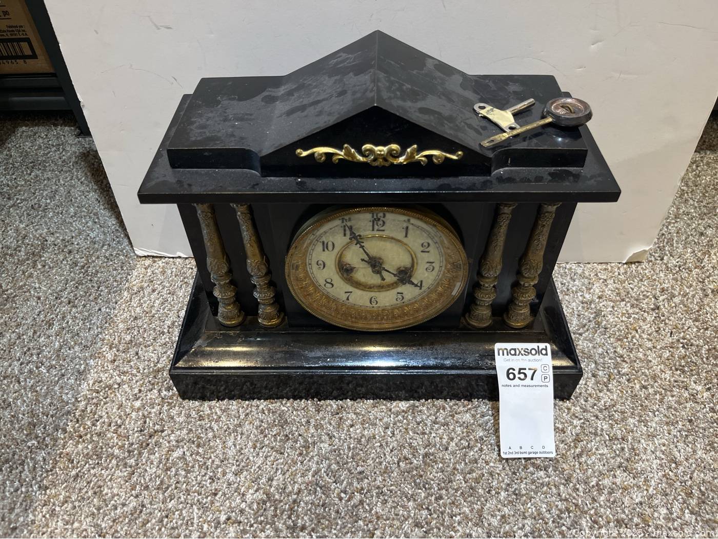 Antique black mantel clock with key | Maxsold