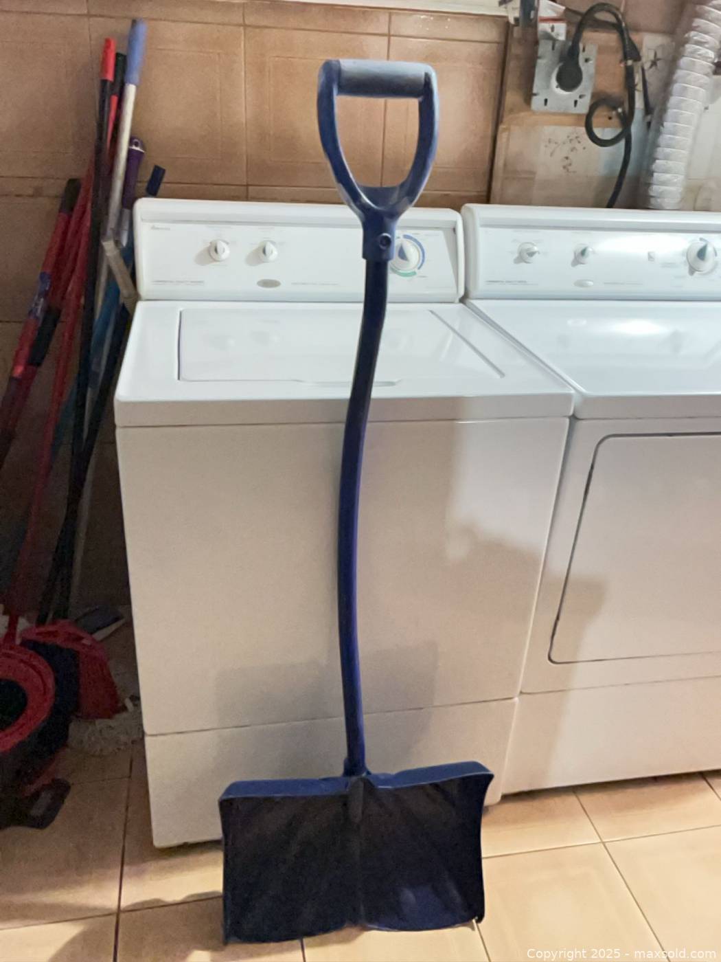 Grey snow float and blue snow shovel | Maxsold