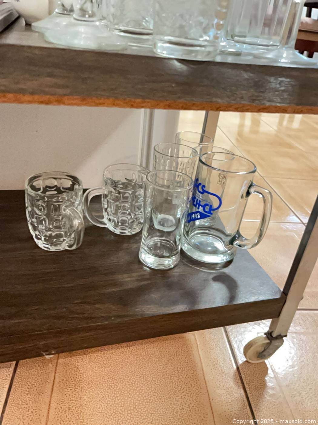 Metal-frame bar cart with assorted glassware | Maxsold