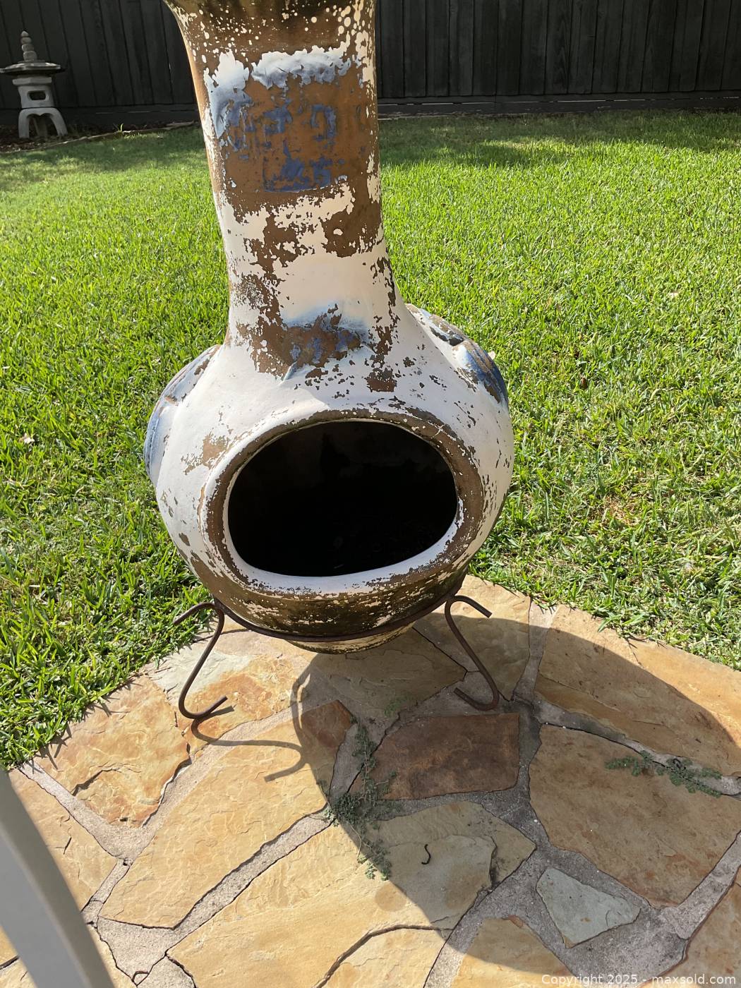 Terracotta outdoor chiminea with stand | Maxsold